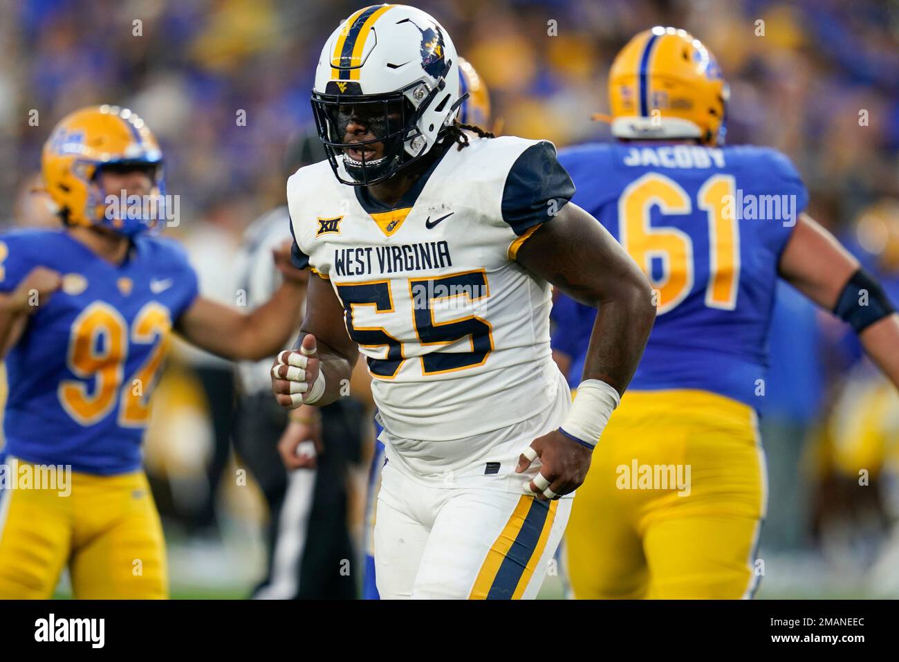 West Virginia defensive lineman Dante Stills (55) plays against ...