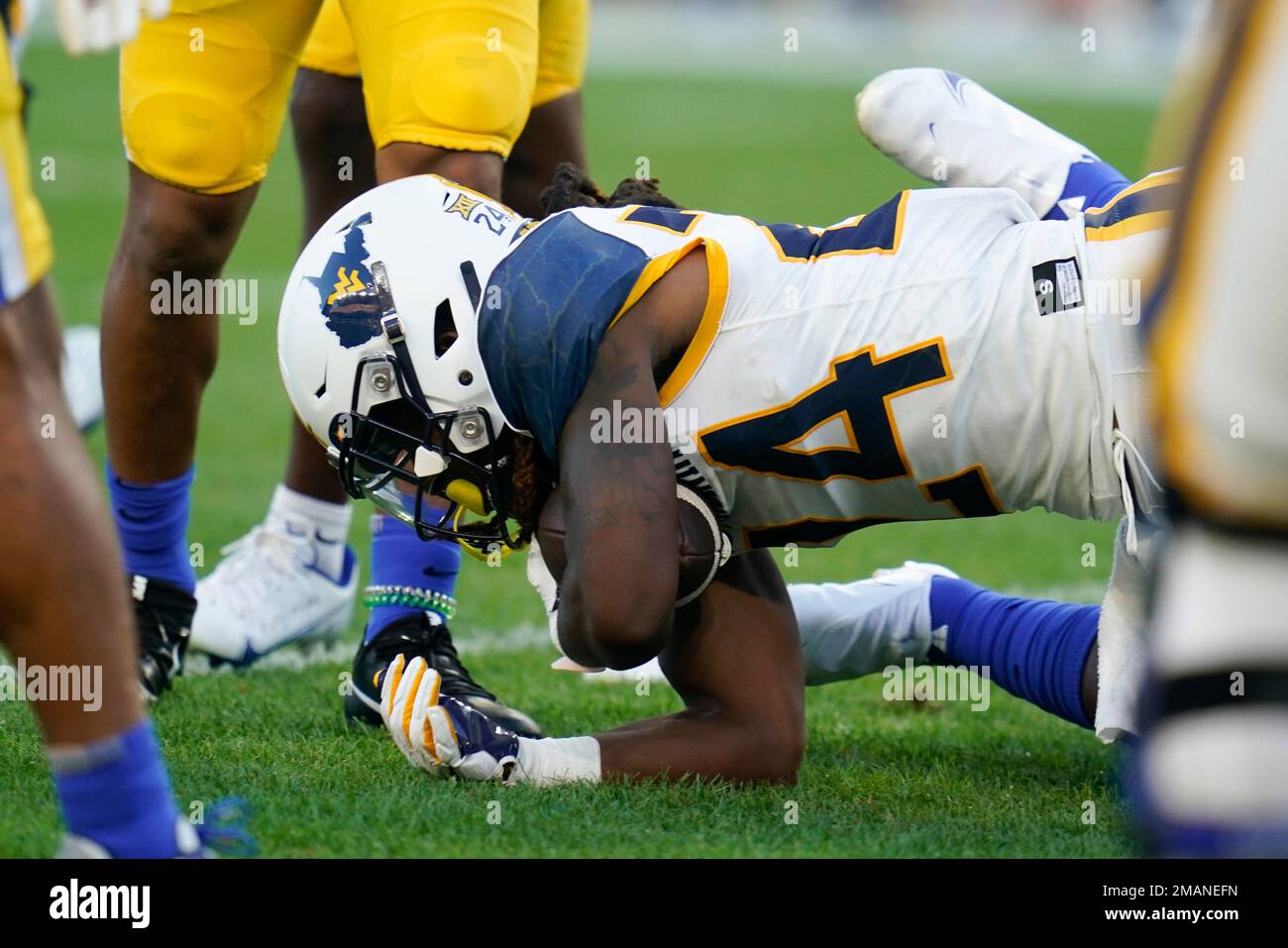 West Virginia offensive lineman James Gmiter (74) plays against ...