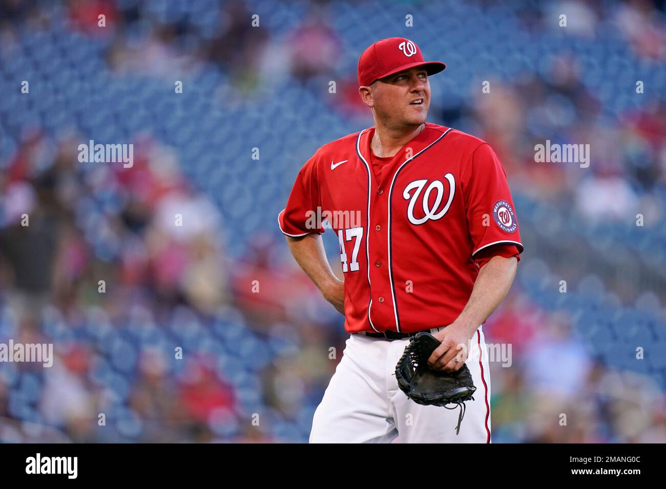 Washington Nationals relief pitcher Jake McGee walks off the field ...