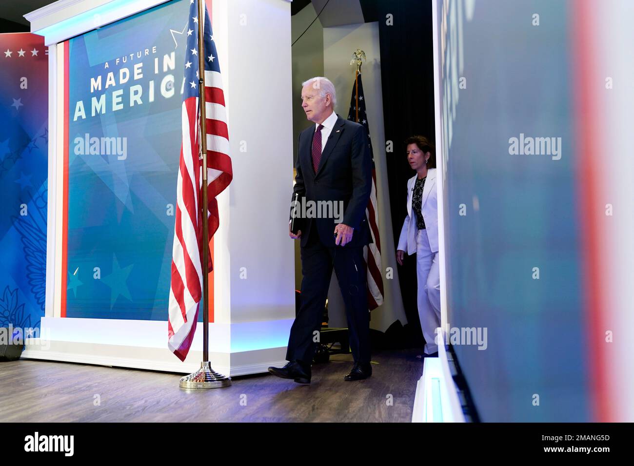 President Joe Biden arrives with Commerce Secretary Gina Raimondo to ...