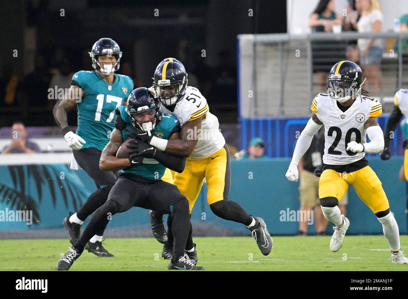 Jacksonville Jaguars wide receiver Christian Kirk (13) is tackled by Pittsburgh Steelers ...