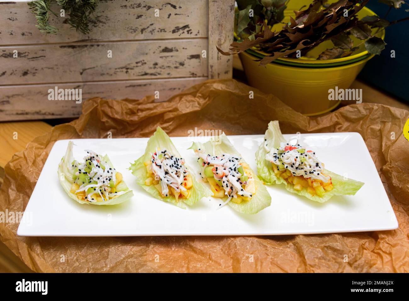 Breadless snacks on iceberg lettuce leaves cucumber slices and diced ...