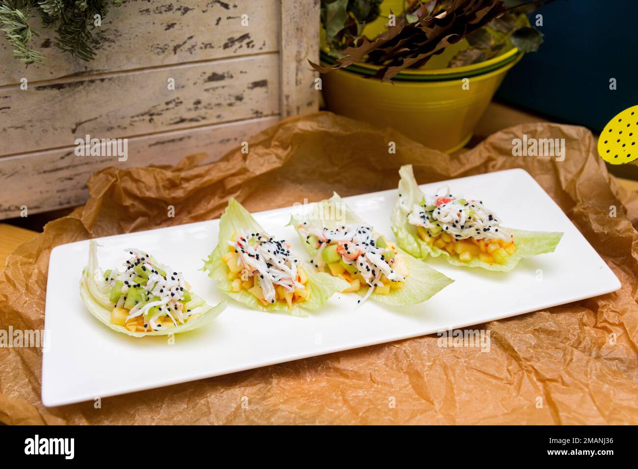 Breadless snacks on iceberg lettuce leaves cucumber slices and diced ...