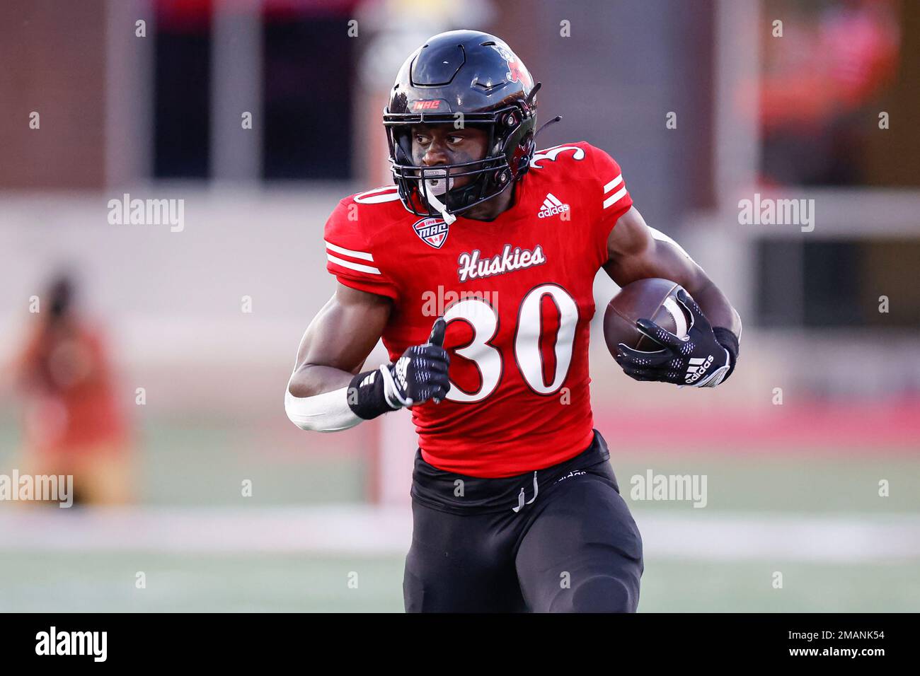 Northern Illinois Huskies running back Harrison Waylee runs with the ... Northern Illinois Huskies running back Harrison Waylee runs with the ...
