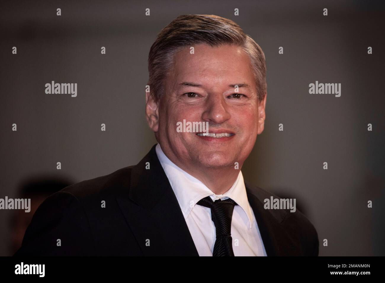 Ted Sarandos poses for photographers upon arrival at the premiere of ...