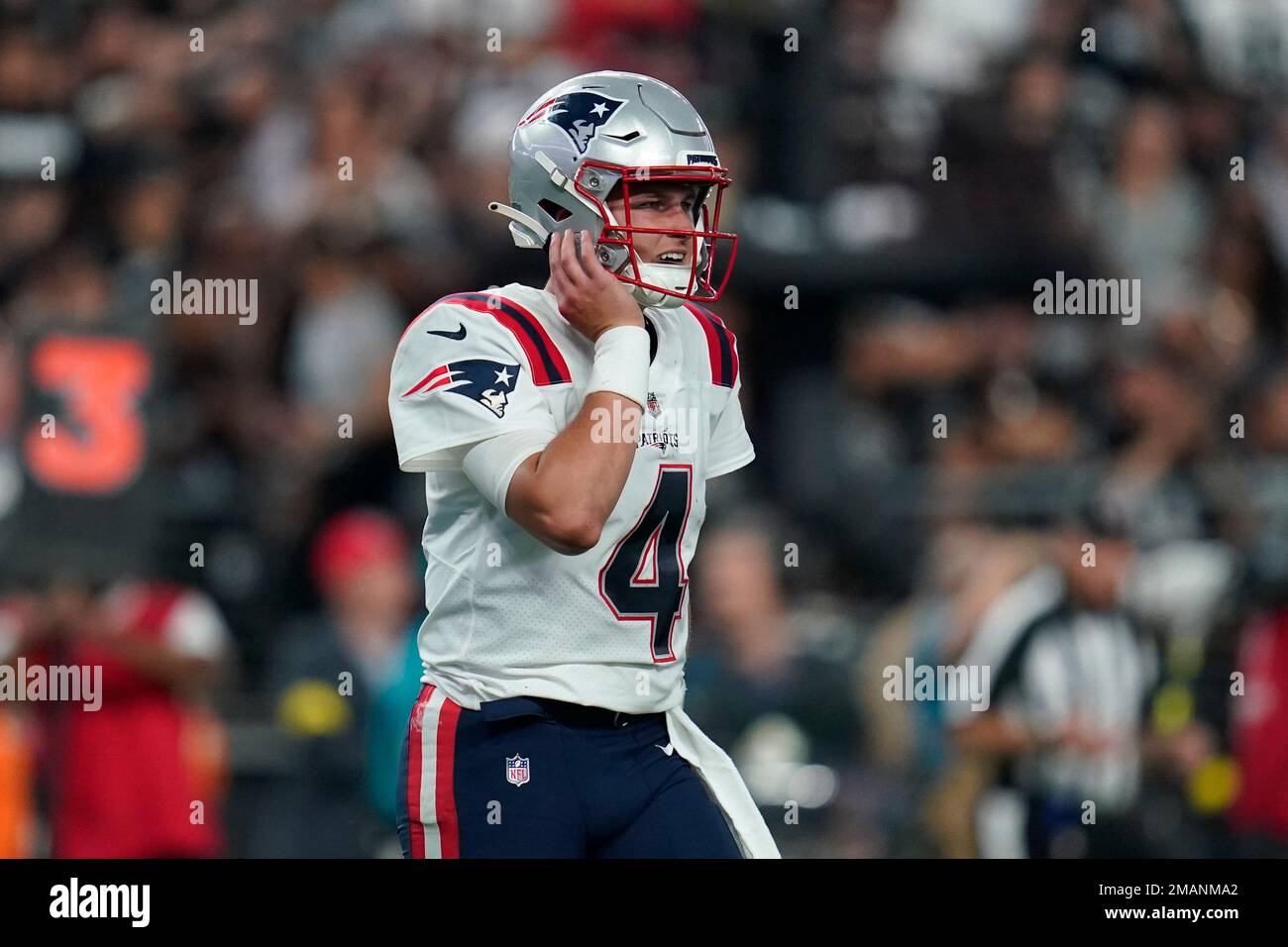 New England Patriots quarterback Bailey Zappe (4) stands on the field ...