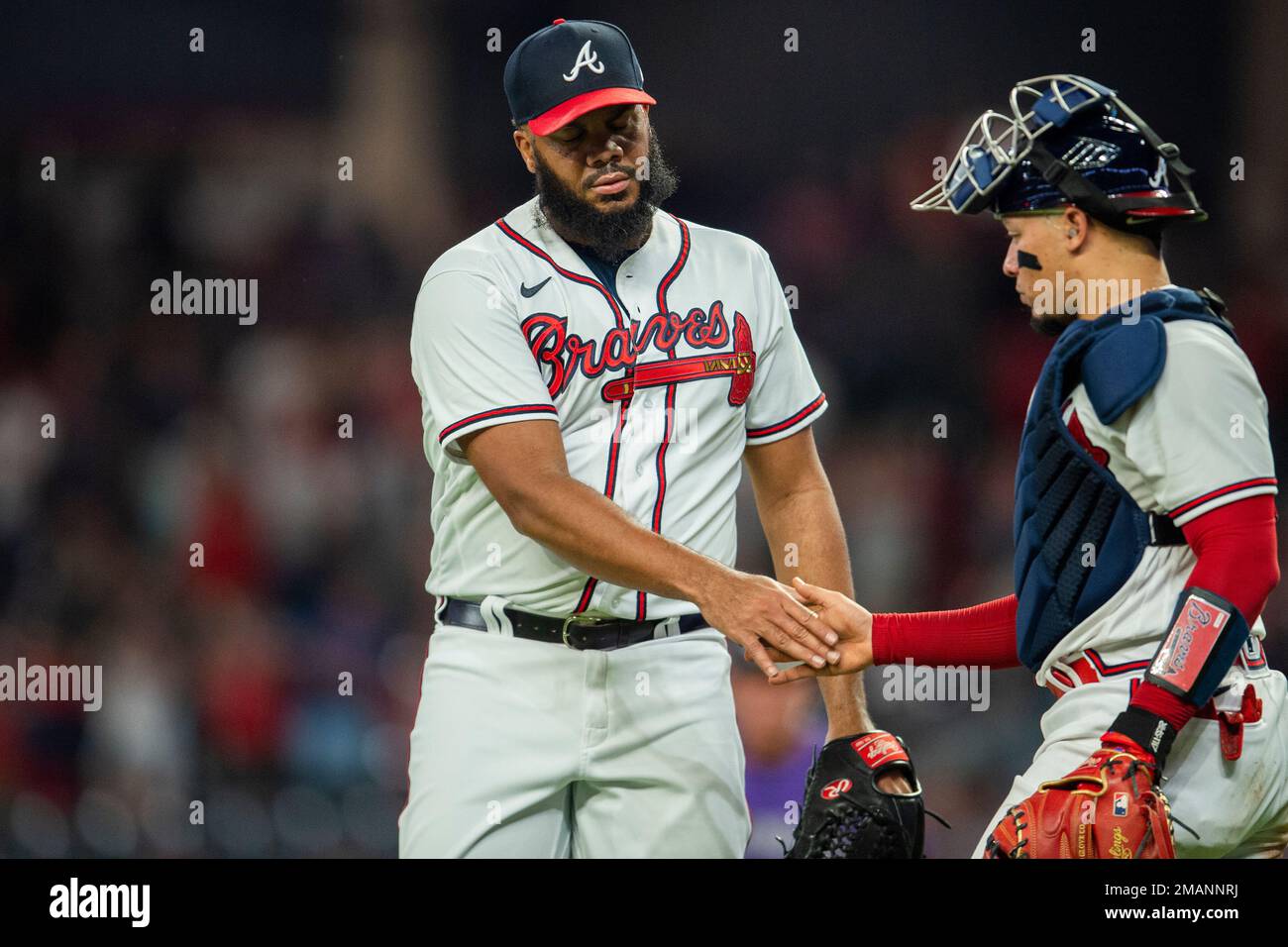 Atlanta Braves catcher William Contreras shakes hands with relief ...