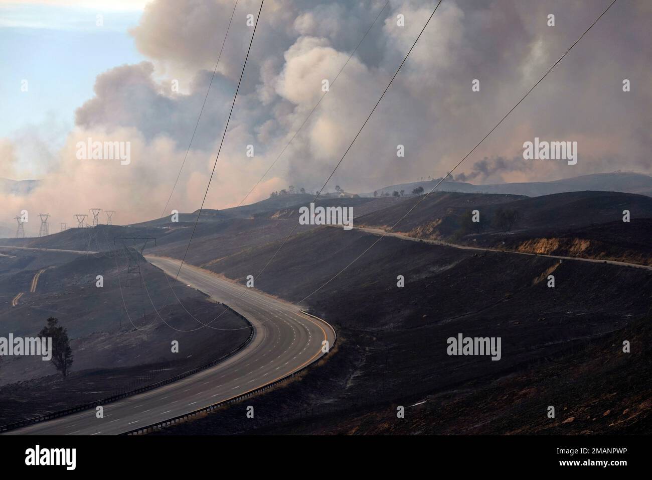 The Route Fire burns over the closed-off interstate 5 Wednesday, Aug ...