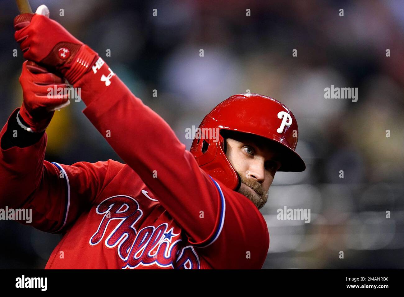 Philadelphia Phillies' Bryce Harper takes a practice swing during the first inning of a baseball ...