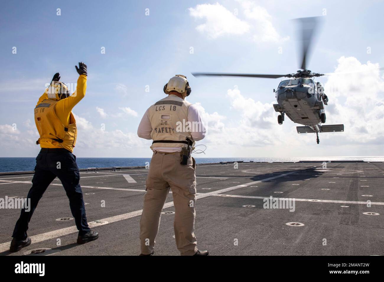 230117-N-HG846-1113 SOUTH CHINA SEA (January 17, 2023) – Sailors direct ...