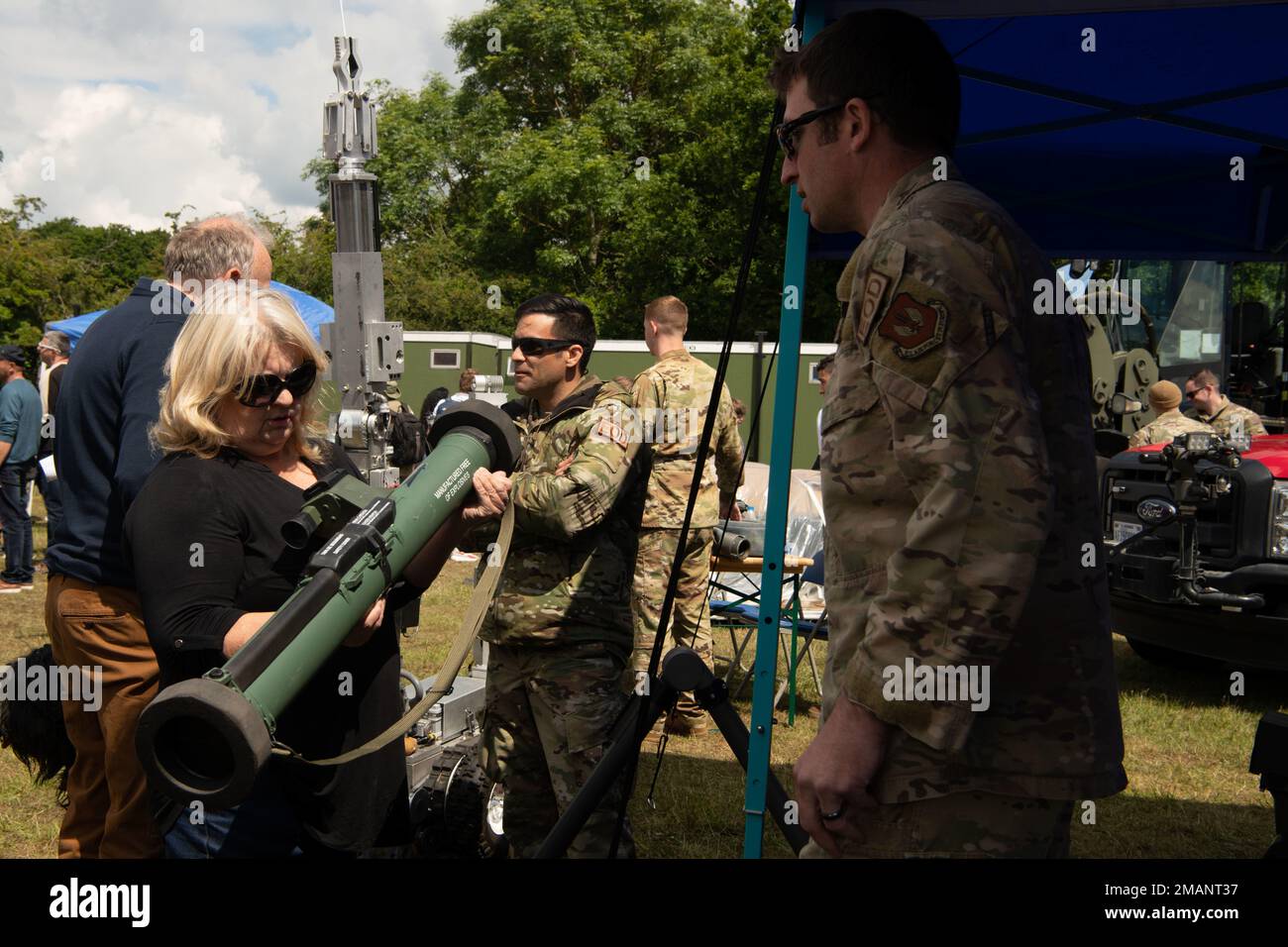 A spectator participates in a military weapons display at the Suffolk ...