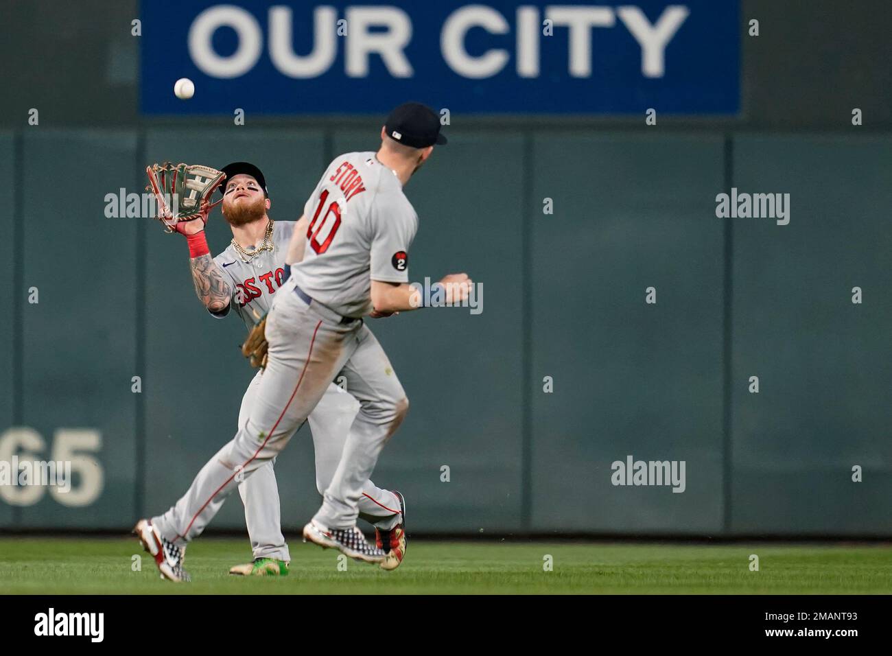 Boston Red Sox right fielder Alex Verdugo, left, catches a fly ball by ...