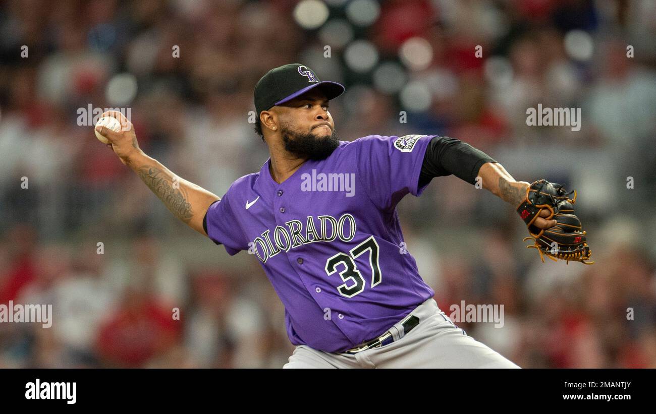 Colorado Rockies relief pitcher Alex Colome throws against the Atlanta ...