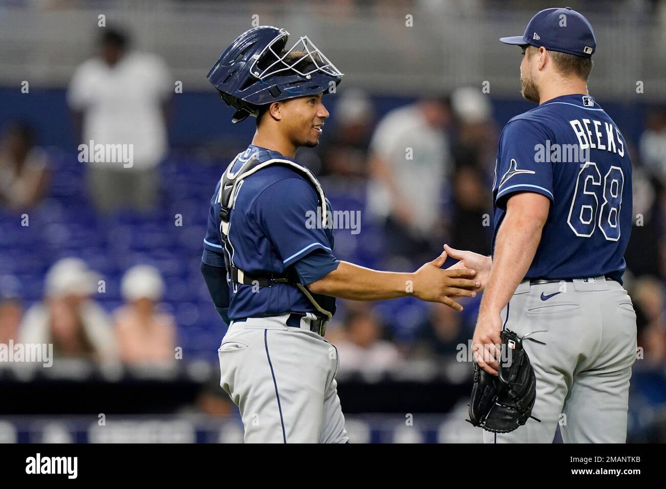 Tampa Bay Rays catcher Francisco Mejia, left, shakes hands with relief ...