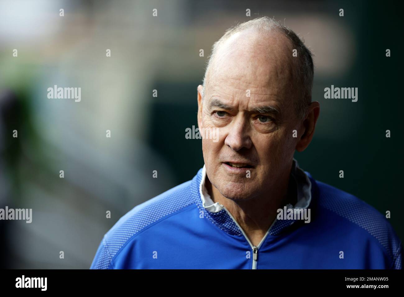 New York Mets president Sandy Alderson walks in the dugout before the ...