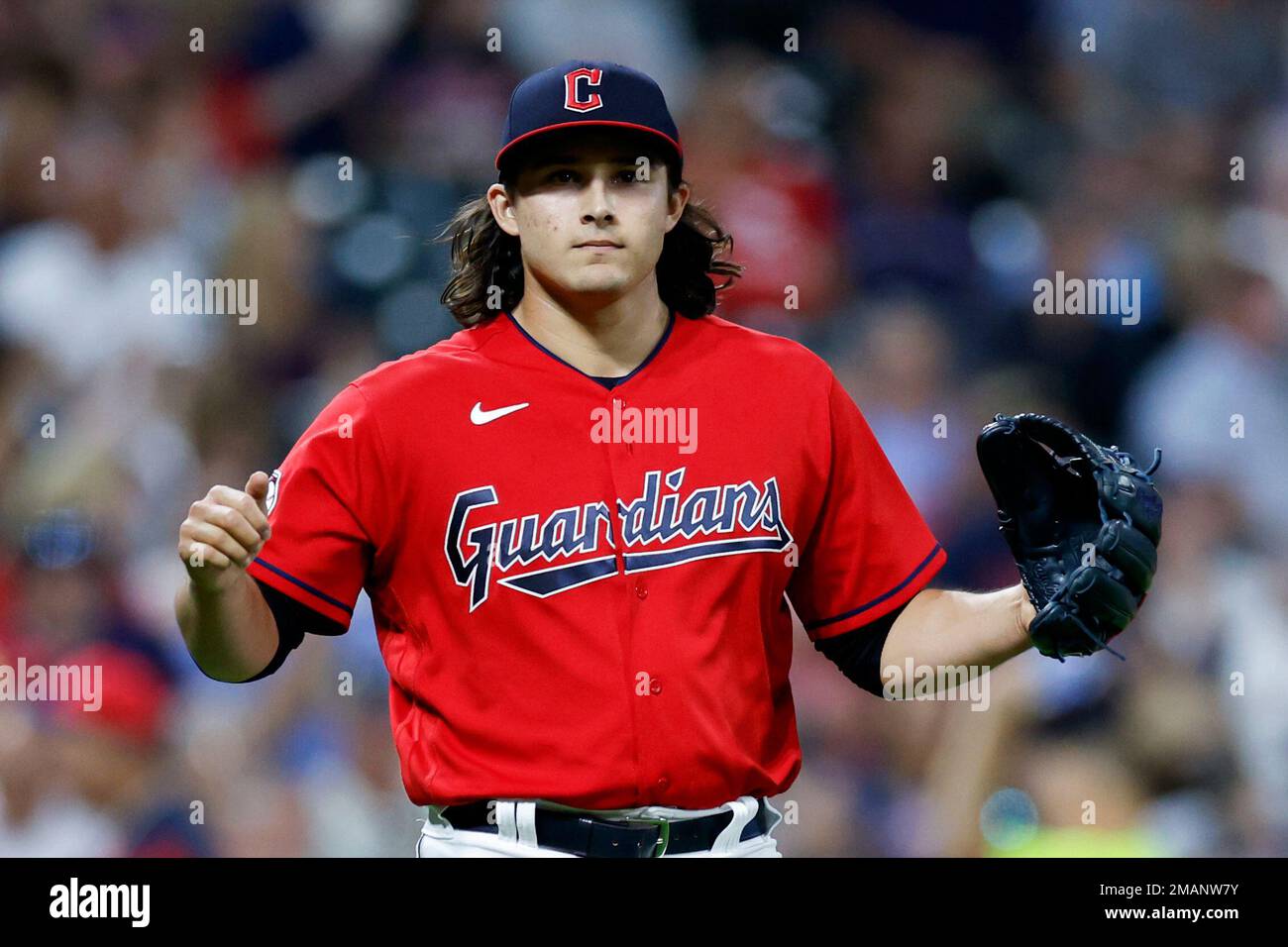 Cleveland Guardians relief pitcher Eli Morgan reacts after giving up a ...