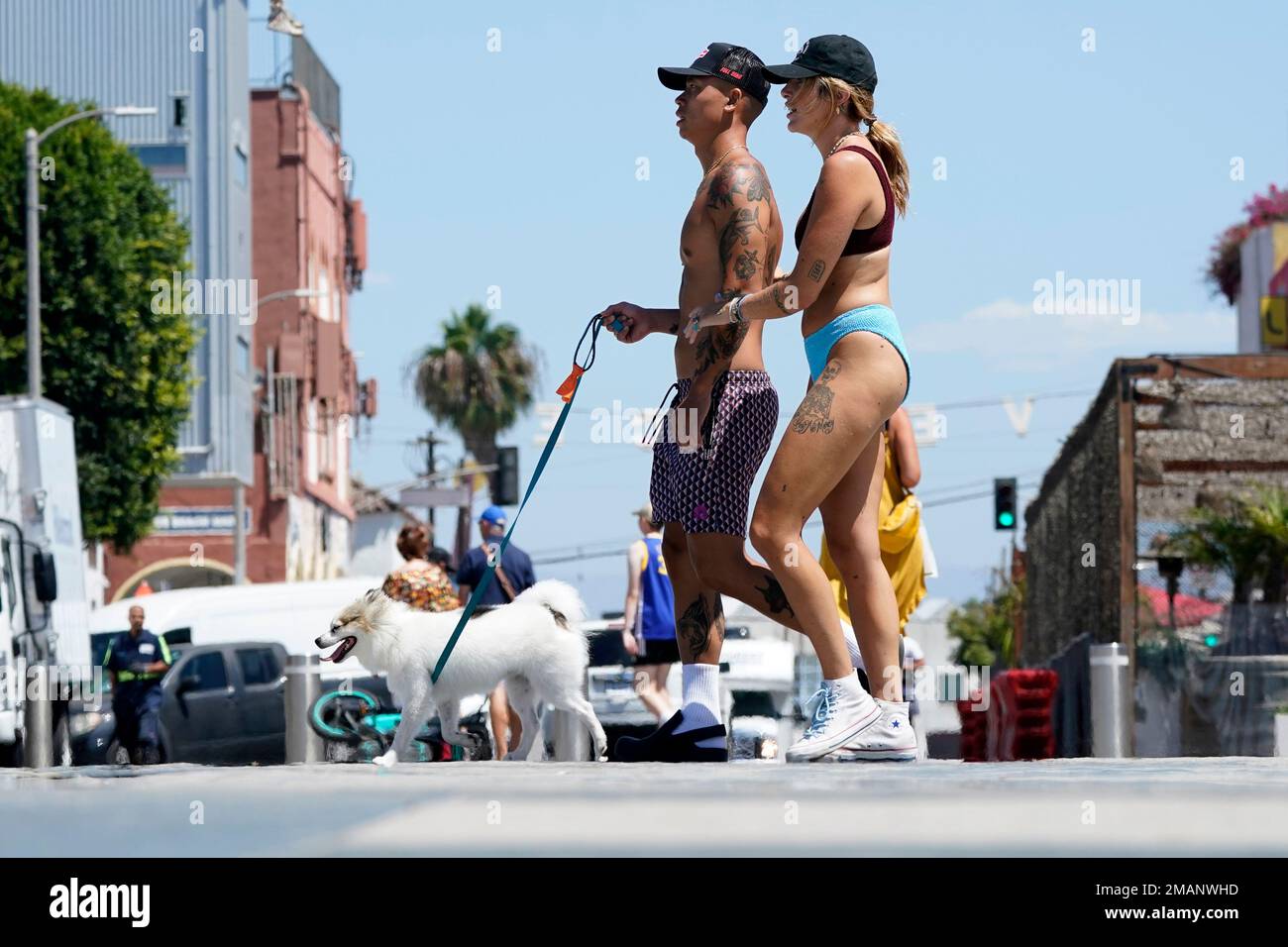 Visitors wear swim suits amid triple digit temperatures in various ... Visitors wear swim suits amid triple digit temperatures in various ...