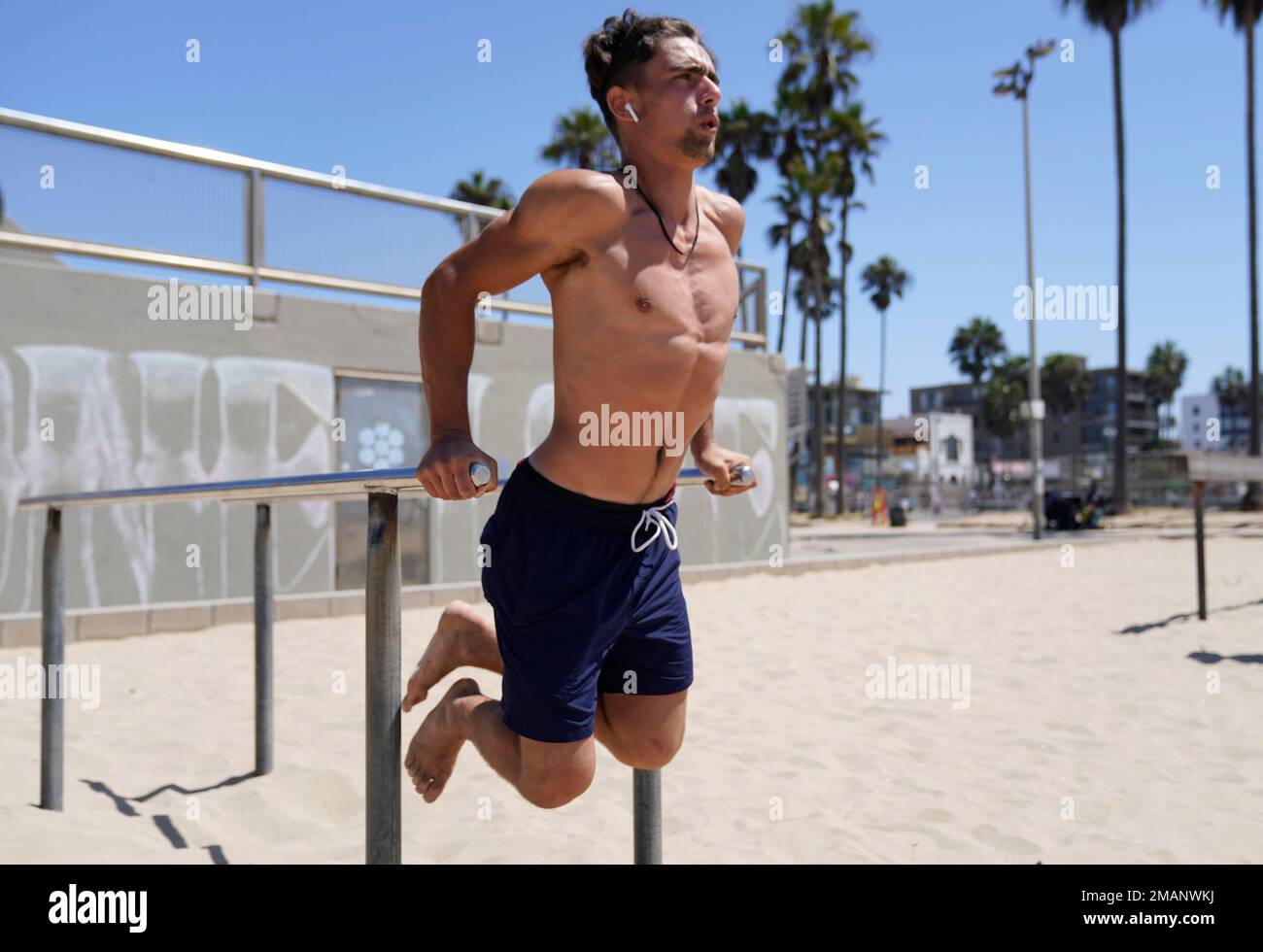 Louis Spaci, visiting from France, works out, amid triple digit ... Louis Spaci, visiting from France, works out, amid triple digit ...