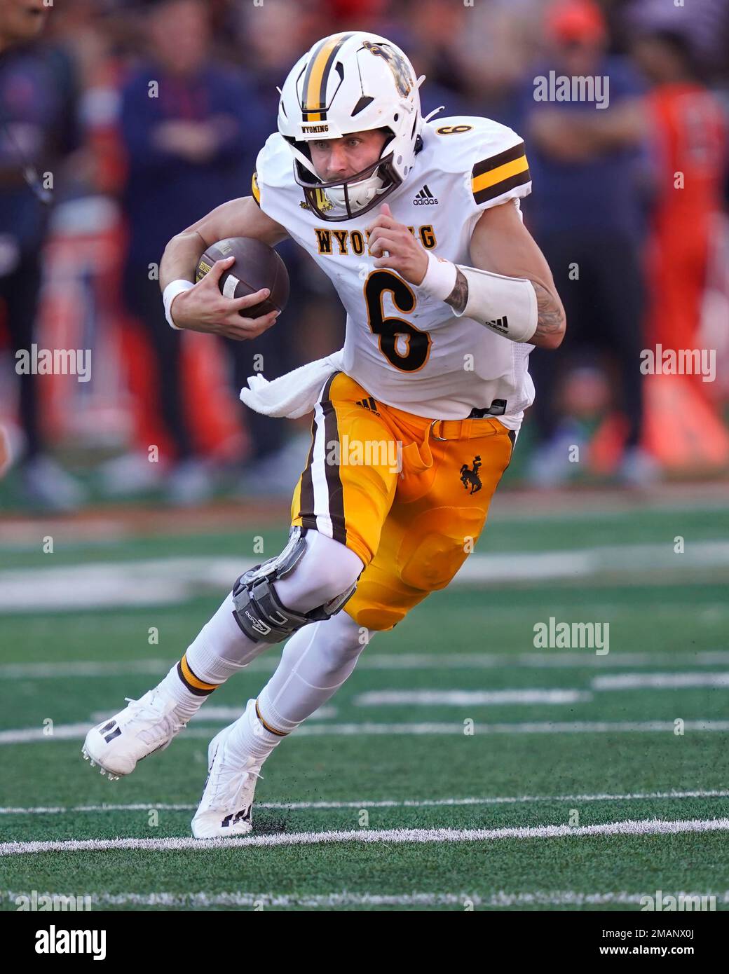 Wyoming quarterback Andrew Peasley carries the ball during an NCAA ...