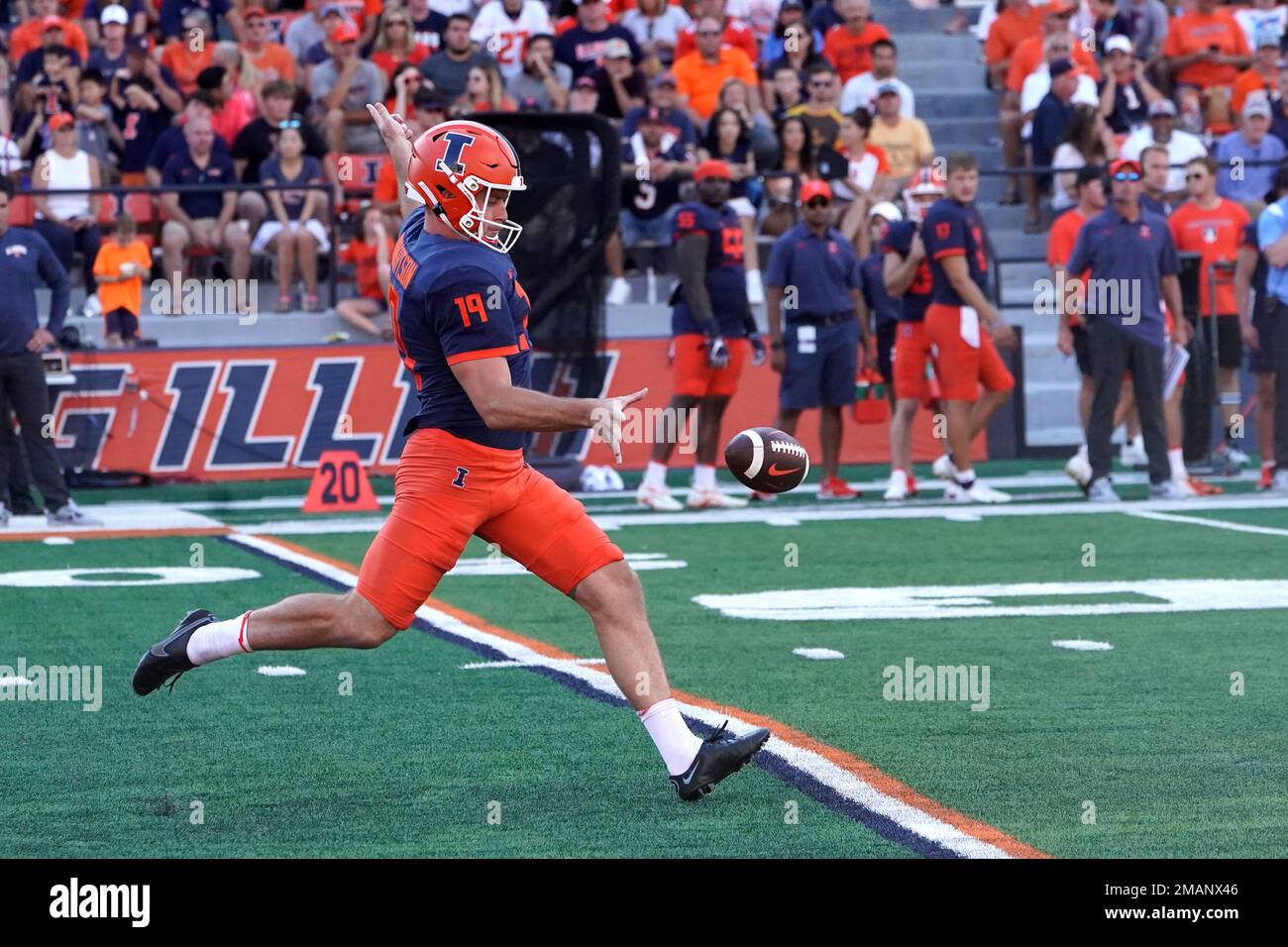 Illinois punter Hugh Robertson punts during an NCAA college football game against Wyoming ...