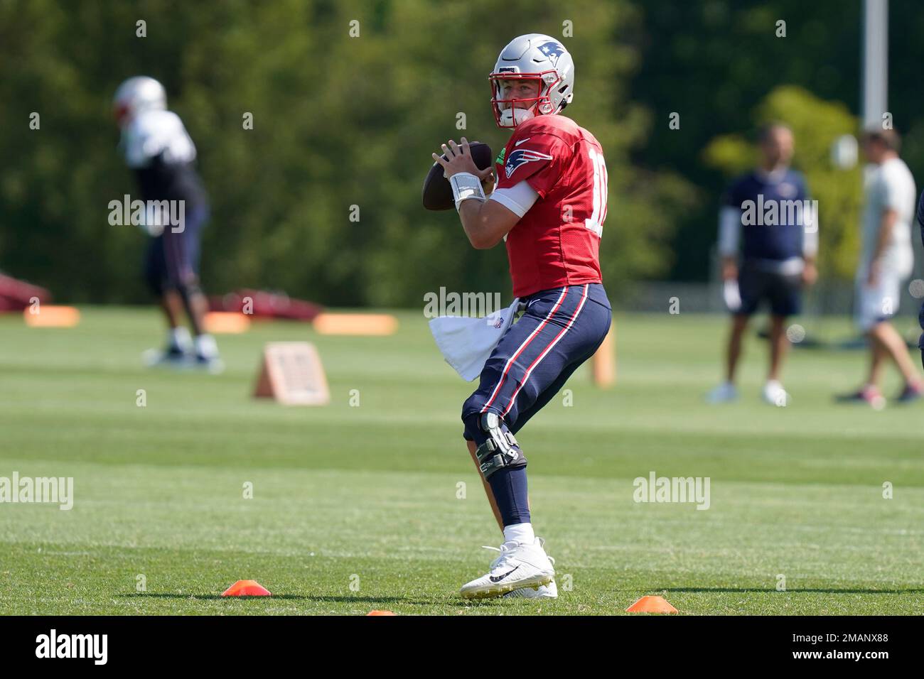 New England Patriots quarterback Mac Jones (10) looks to pass during an ...