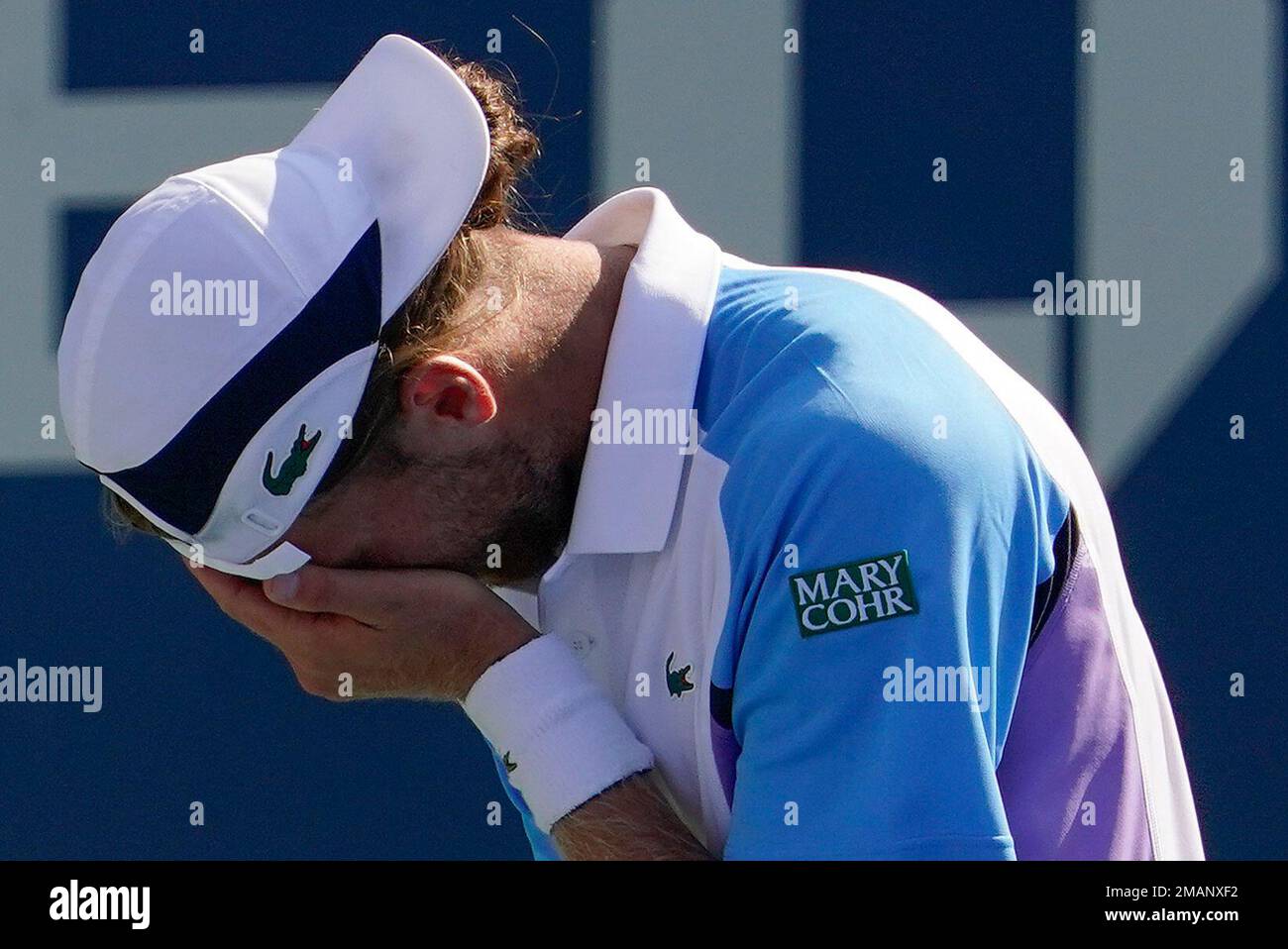 Hugo Grenier, of France, reacts during a match against Matteo ...