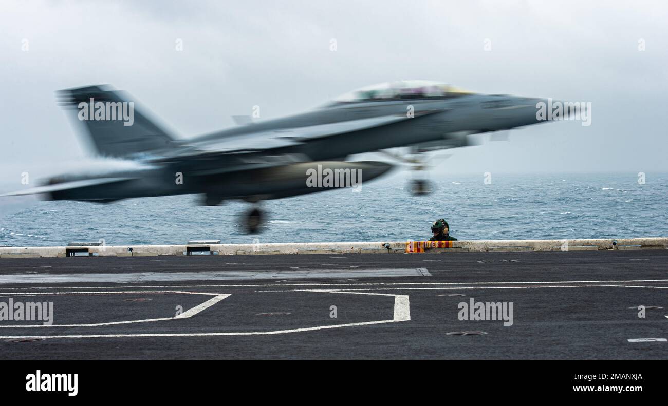 230119-N-MH015-1116 SOUTH CHINA SEA (Jan. 19, 2023) An F/A-18F Super Hornet from the “Mighty ...