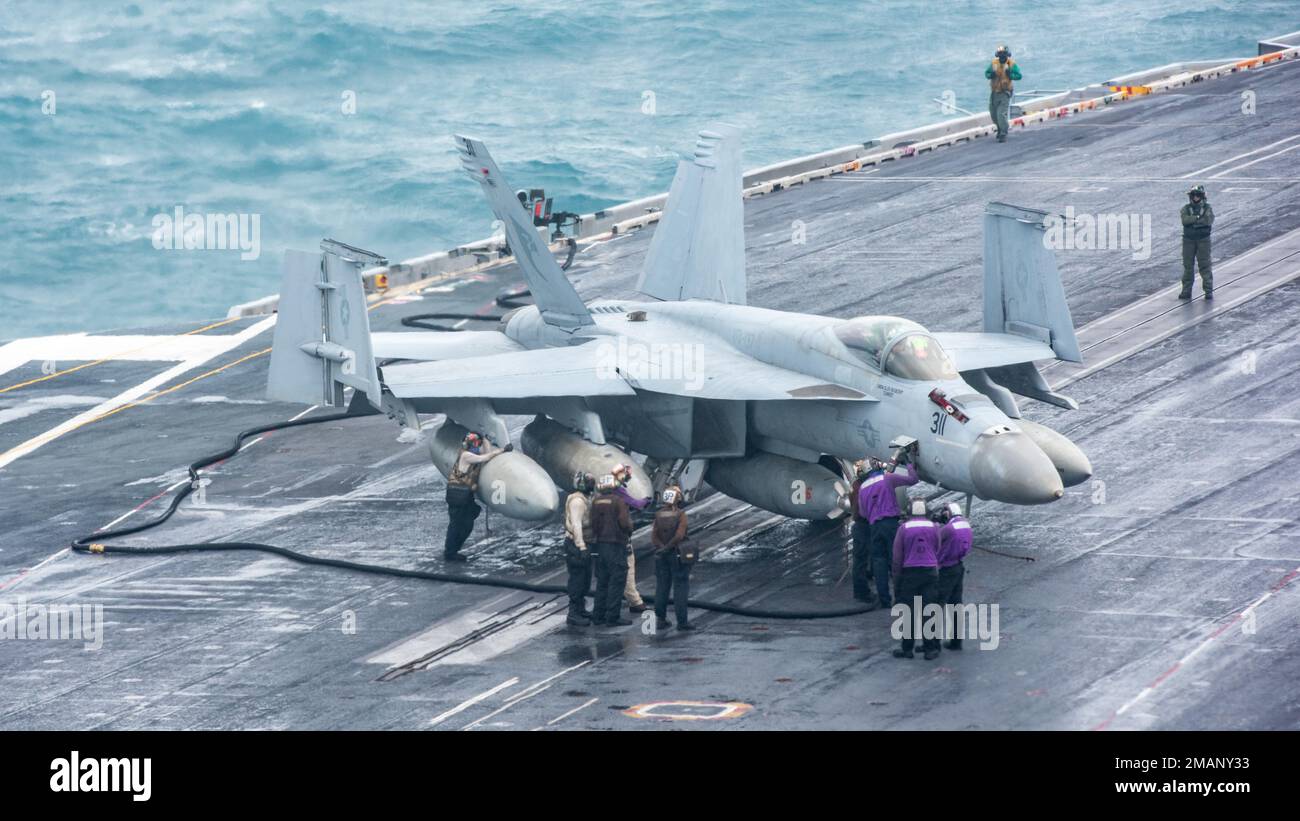 230119-N-NX635-1053 SOUTH CHINA SEA (Jan. 19, 2023) U.S. Navy Sailors refuel an F/A-18E Super ...