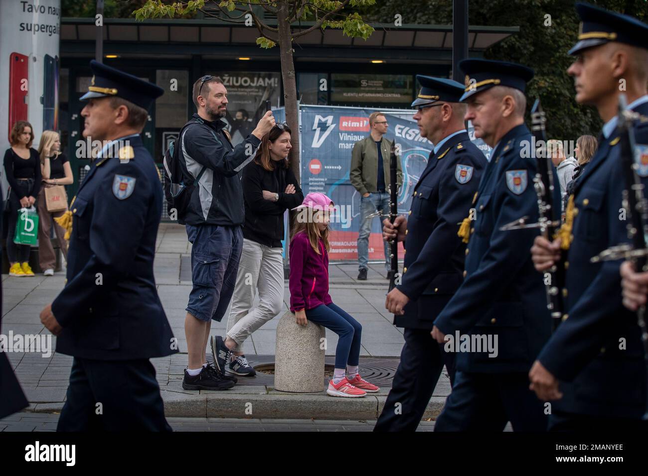 People watch the Lithuanian soldiers march during a celebration of ...