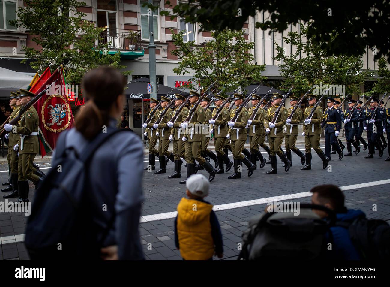 People watch the Lithuanian soldiers march during a celebration of ...