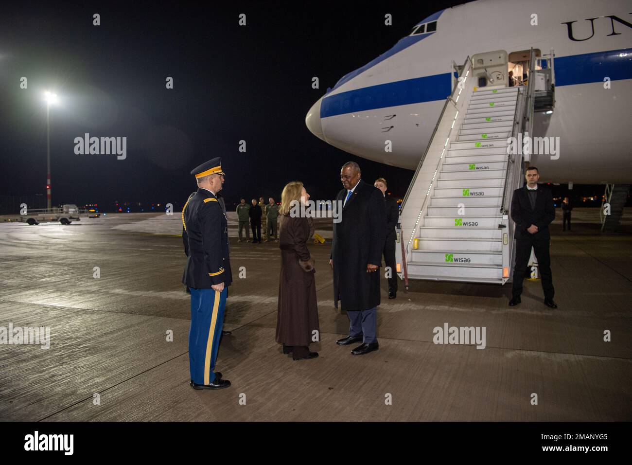 Secretary of Defense Lloyd J. Austin III is greeted by Ambassador Amy ...