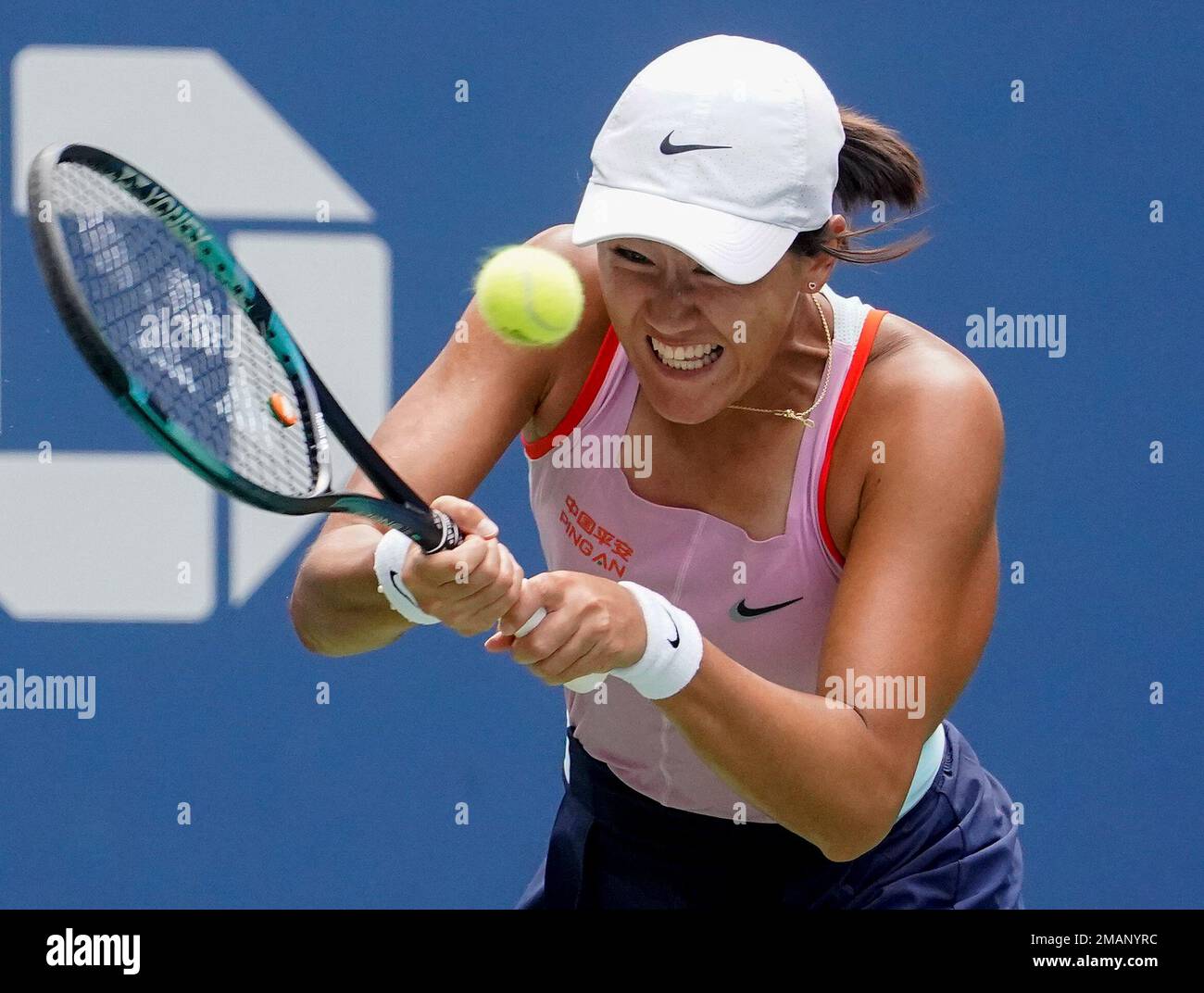 Wang Xiyu, of China, returns a shot to Maria Sakkari, of Greece, during ...