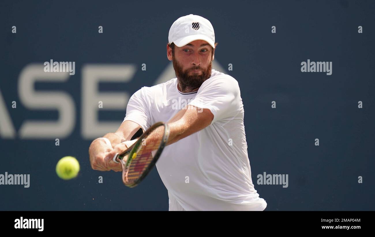 Quentin Halys from France receives the serve during the first round of ...