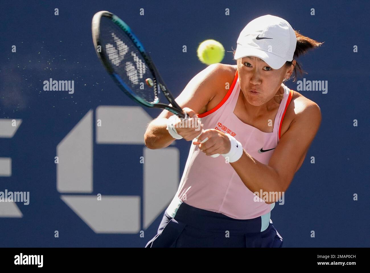 Wang Xiyu, of China, returns a shot to Maria Sakkari, of Greece, during ...