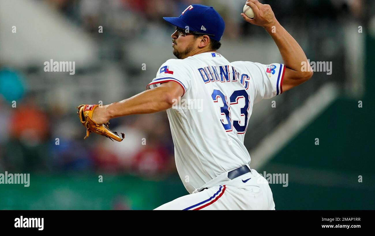 Texas Rangers starting pitcher Dane Dunning throws to the Houston ...