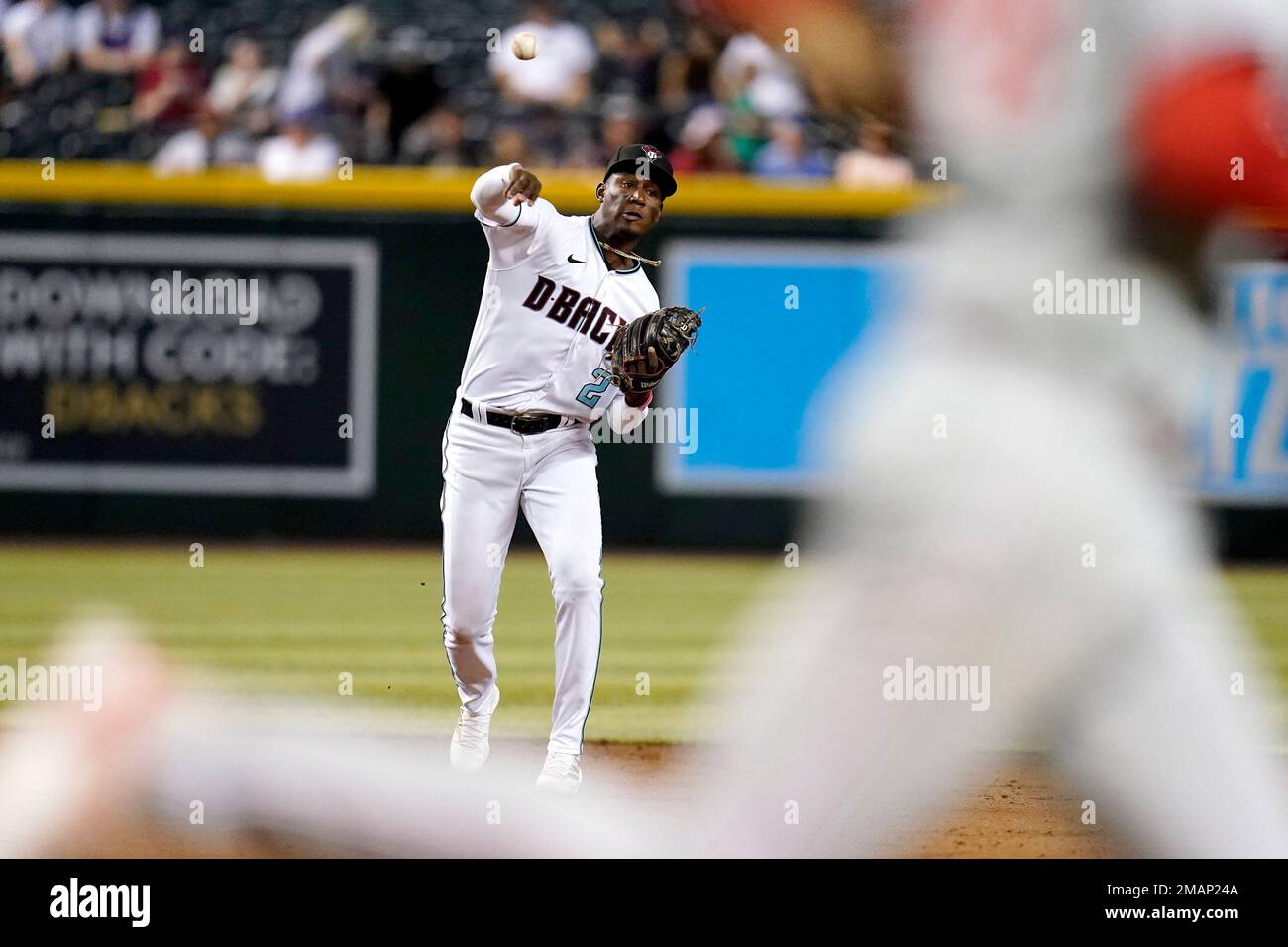 Arizona Diamondbacks shortstop Geraldo Perdomo throws to first base for ...