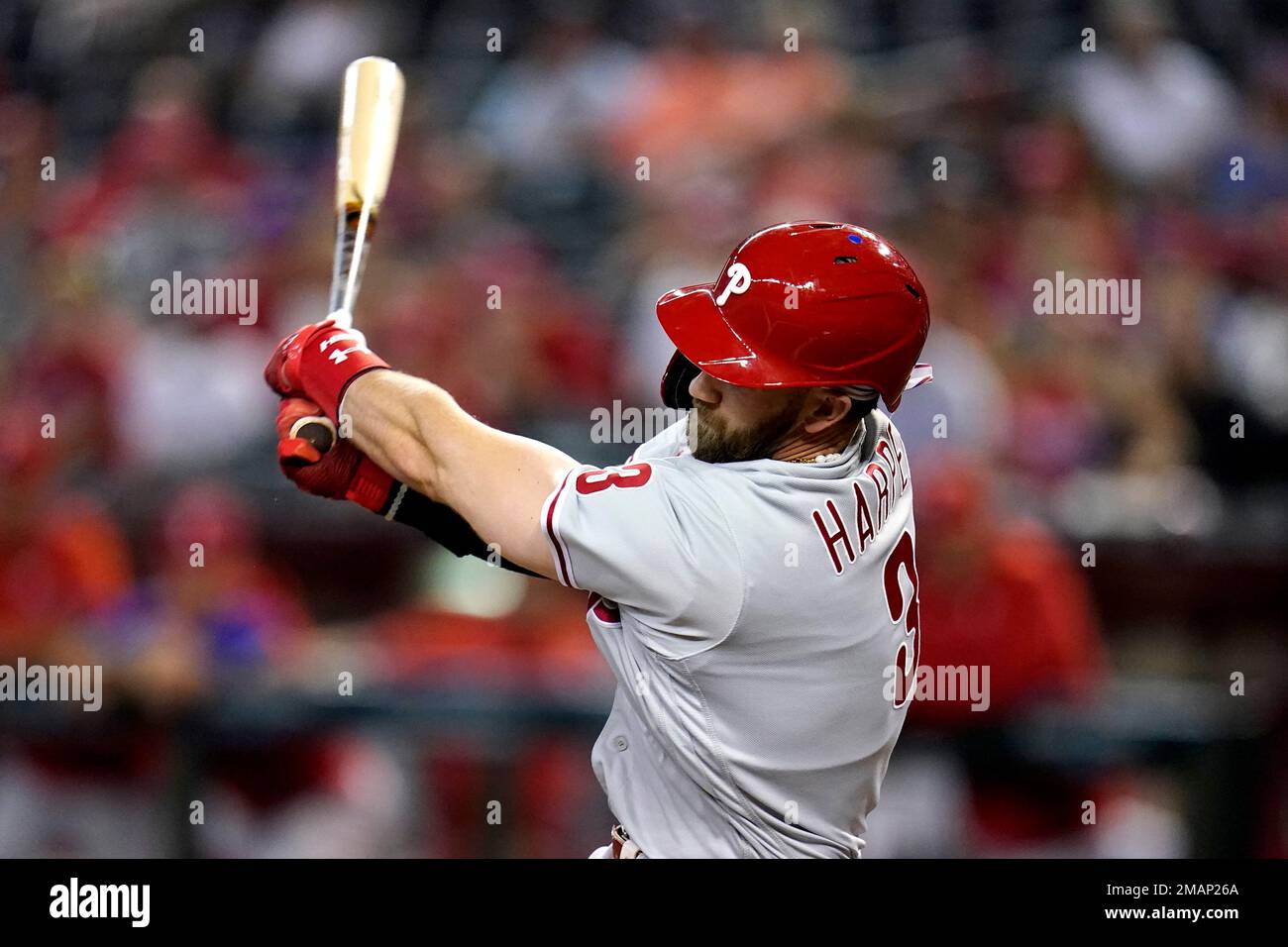 Philadelphia Phillies' Bryce Harper makes a swinging strike against the ...