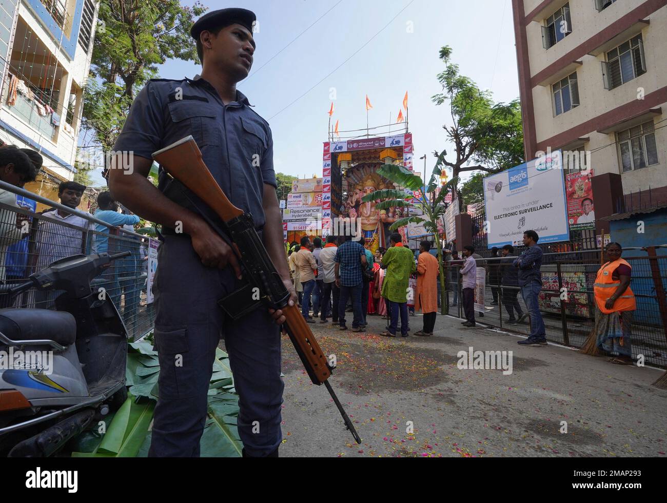 A quick reaction team police officer stands guard near a giant clay ...
