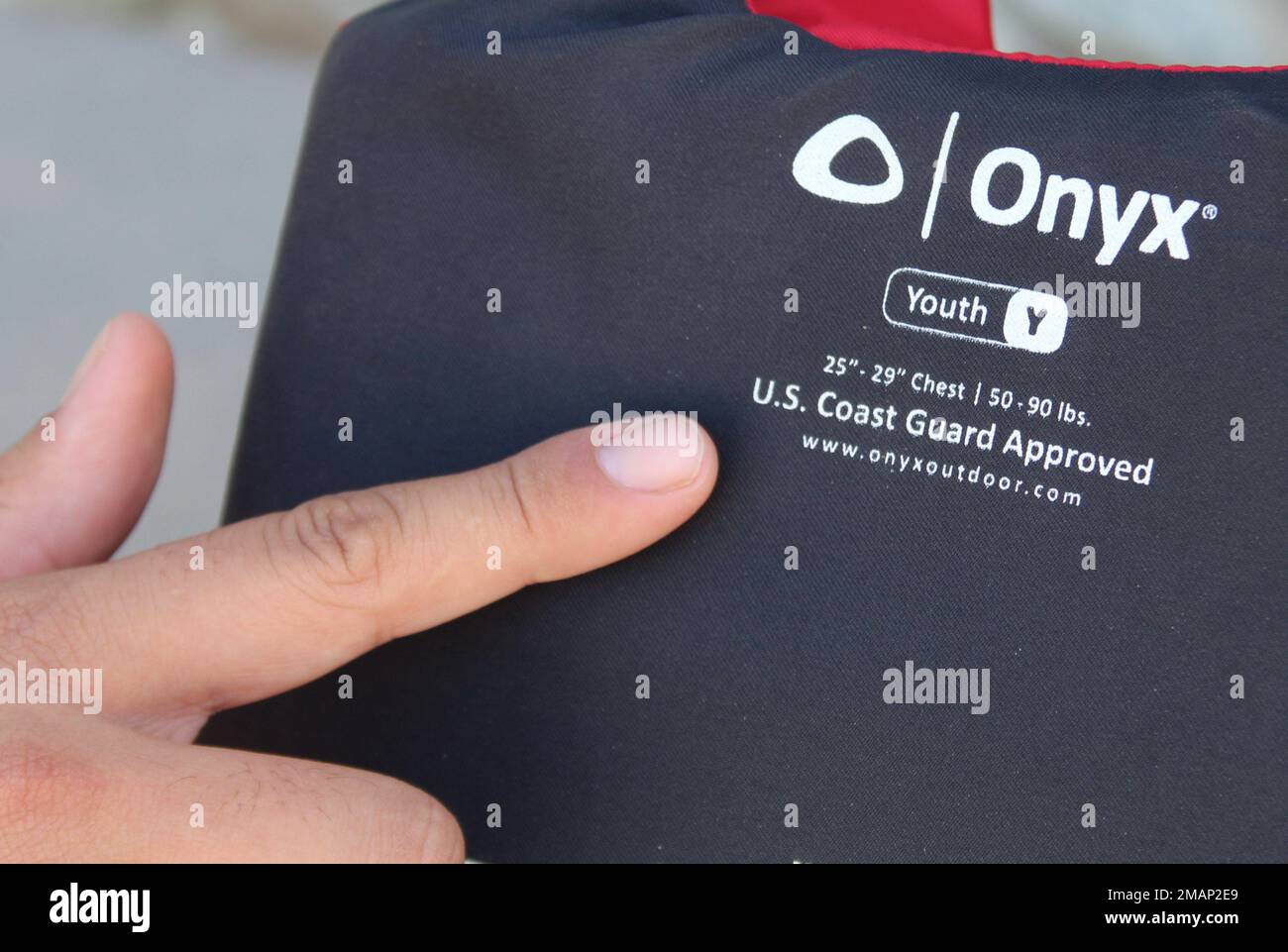 IRWINDALE, California – A lifeguard points to the standard label ...