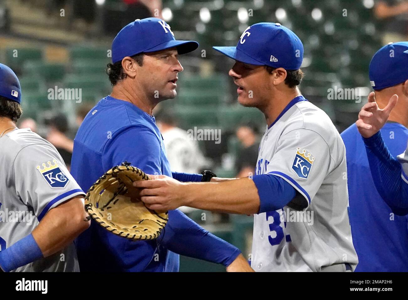 Kansas City Royals manager Mike Matheny, left, celebrates with Nick ...