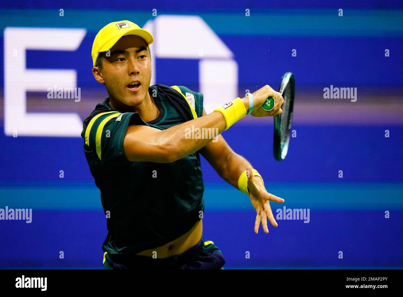 Rinky Hijikata, of Australia, returns a shot to Rafael Nadal, of Spain ...