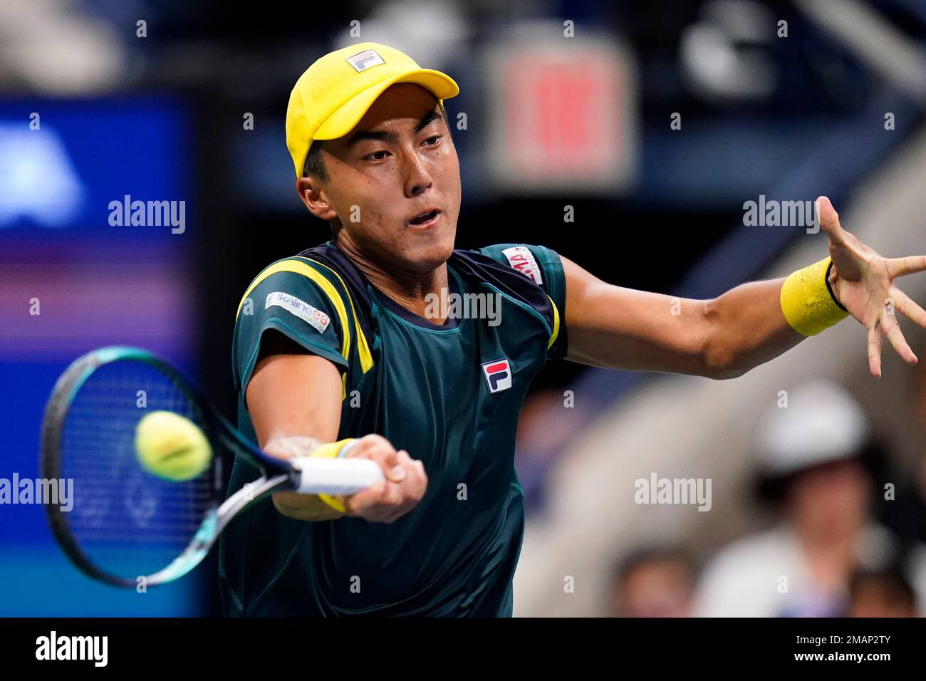 Rinky Hijikata, of Australia, returns a shot to Rafael Nadal, of Spain ...