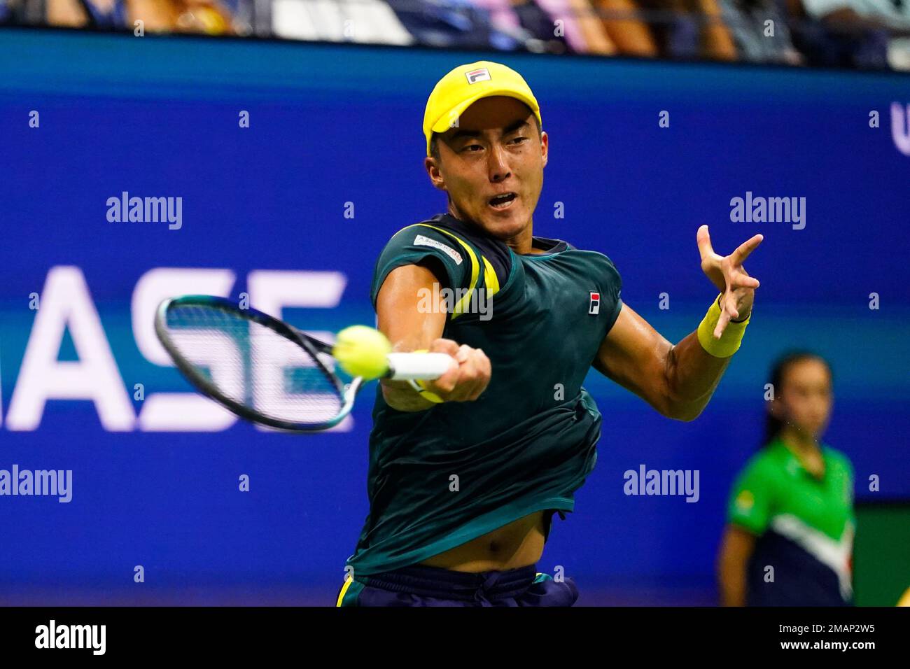 Rinky Hijikata, of Australia, returns a shot to Rafael Nadal, of Spain ...