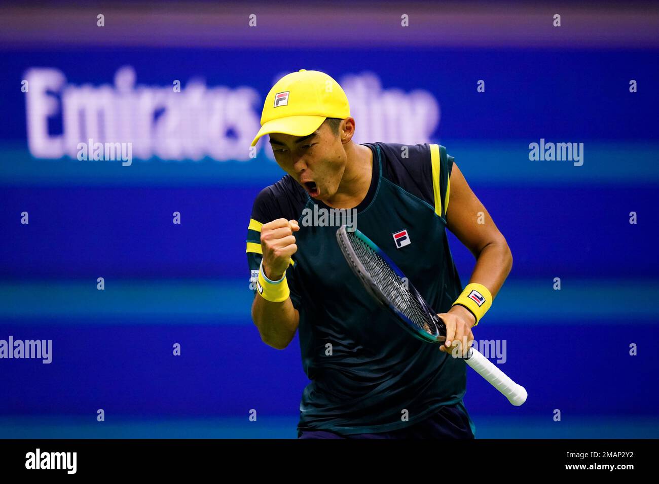 Rinky Hijikata, of Australia, reacts after winning a point against ...