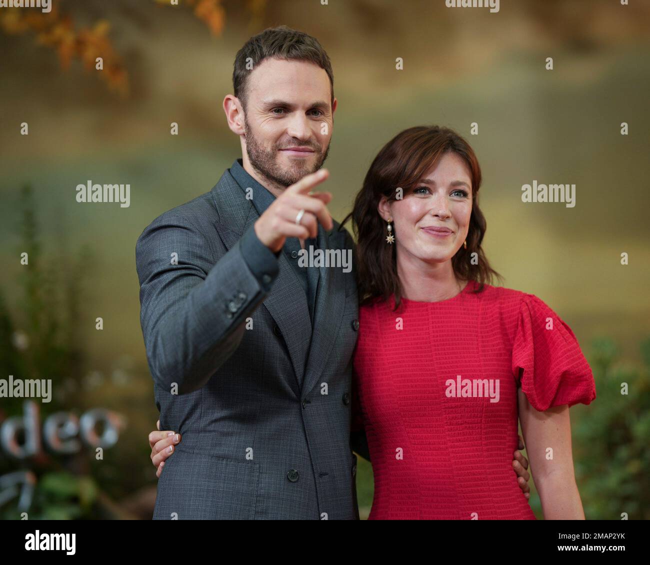 Charlie Vickers, left, and guest pose for photographers upon their ...