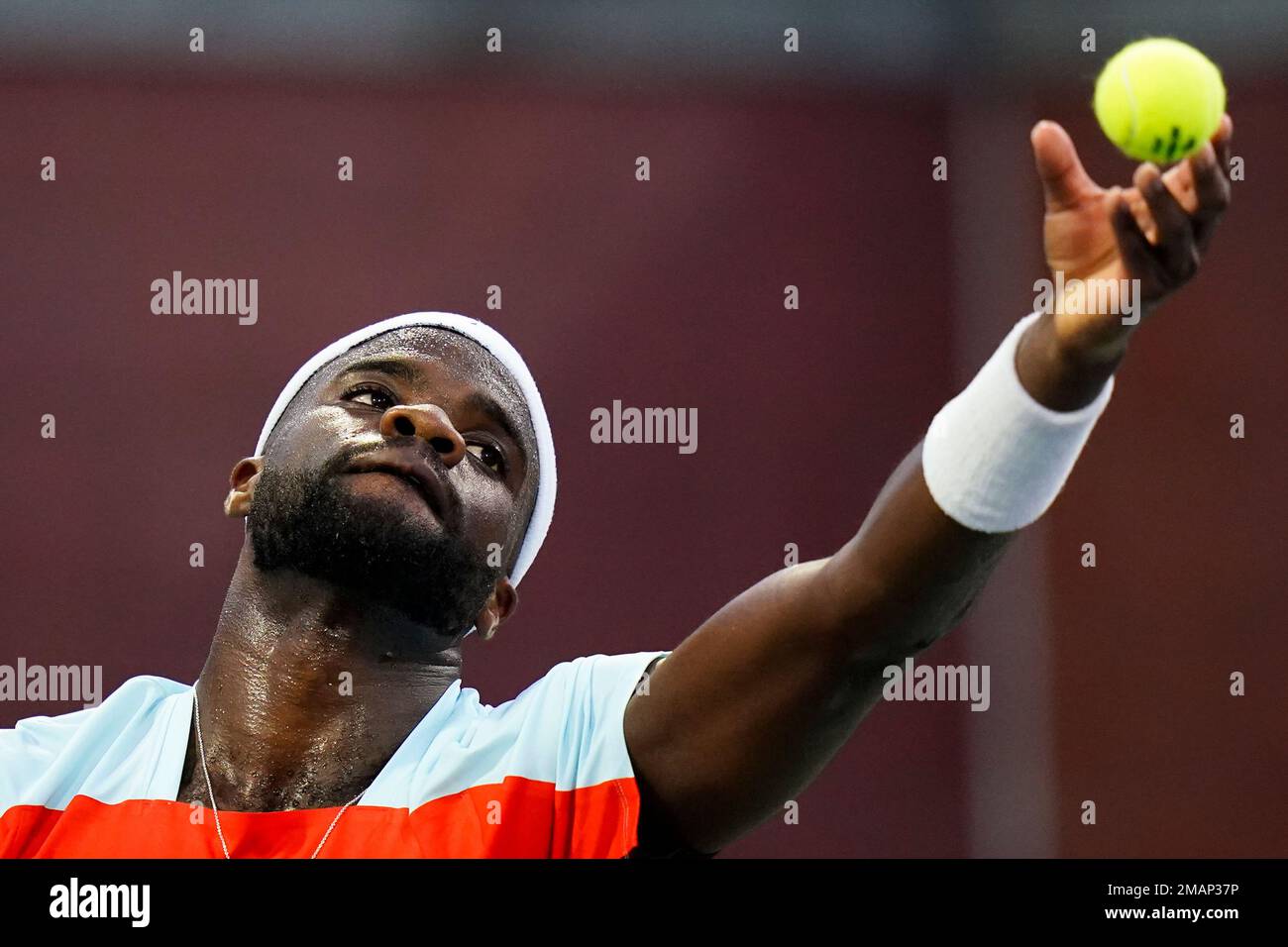 Frances Tiafoe, of the United States, serves to Marcos Giron, of the ...
