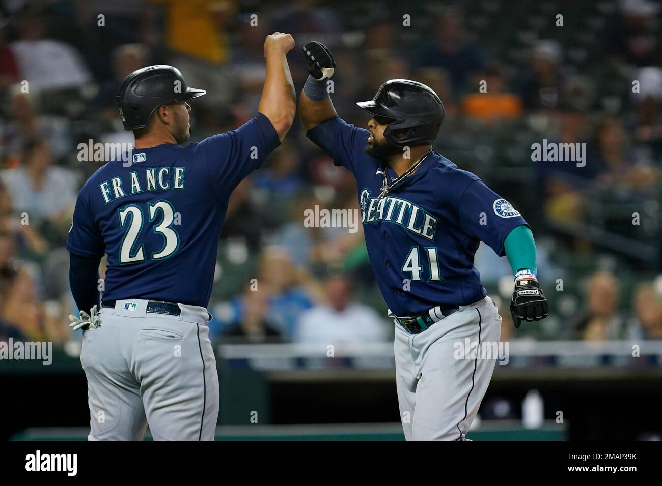Seattle Mariners' Carlos Santana (41) celebrates his two-run home run ...