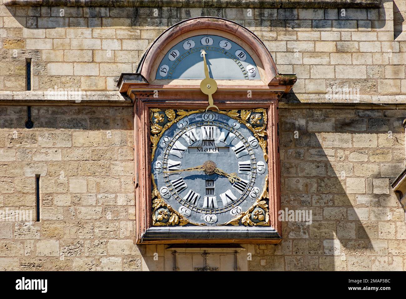 The clock of the Grosse Cloche, a large 18th-century bell over an old ...