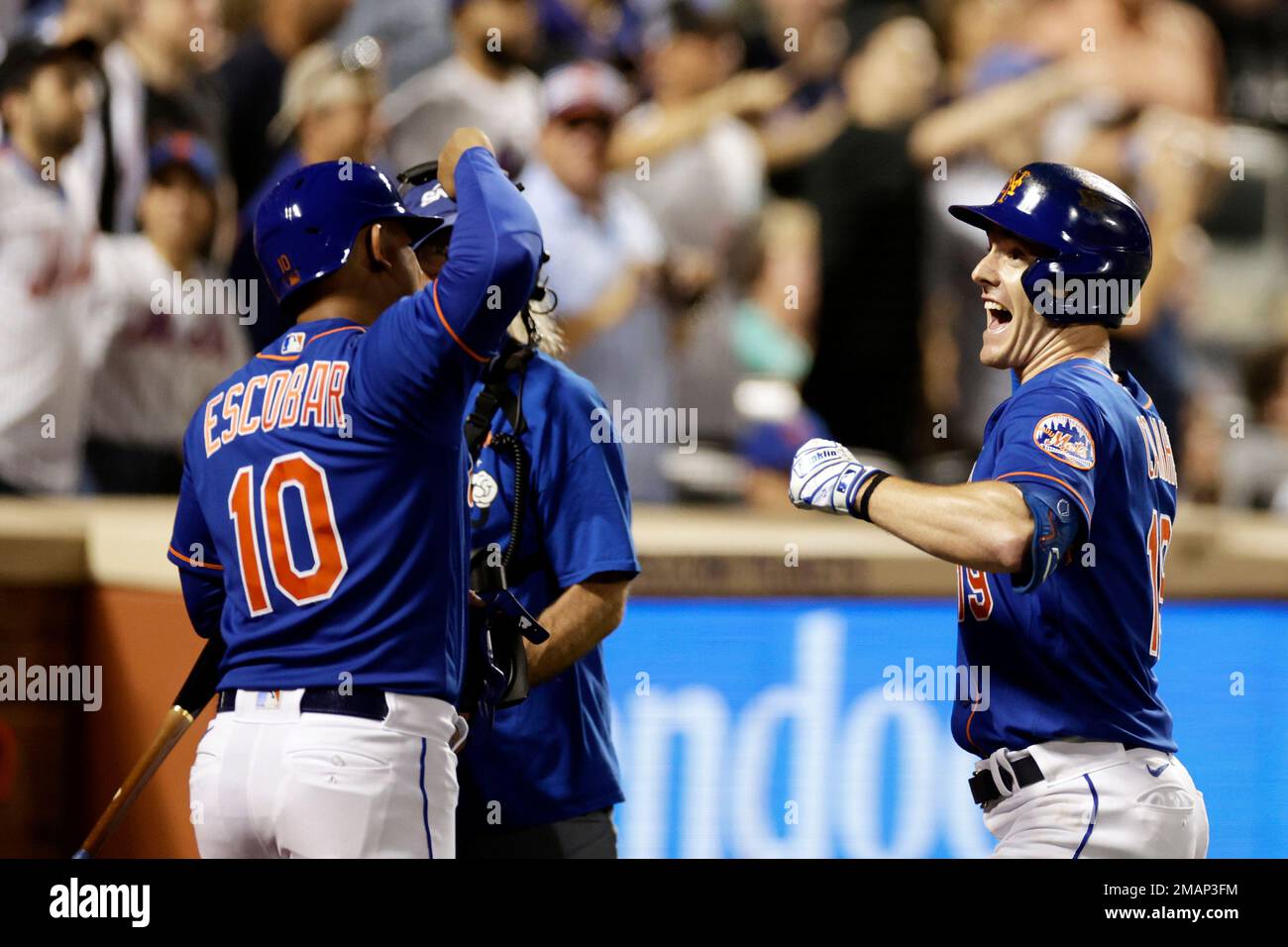 New York Mets' Mark Canha reacts after hitting a home run during the ...