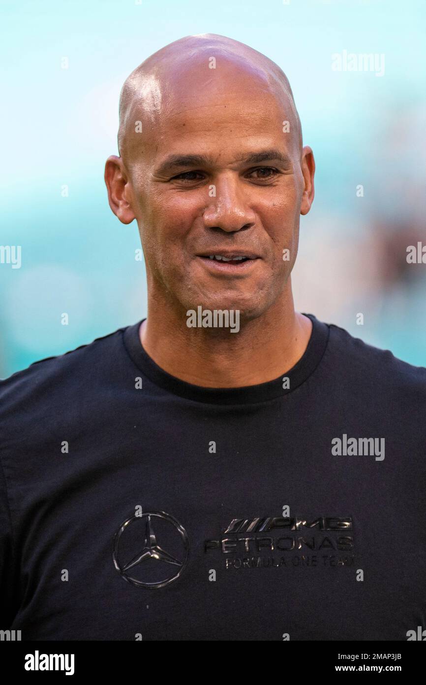 Jason Taylor smiles on the sidelines before the start of an NFL ...